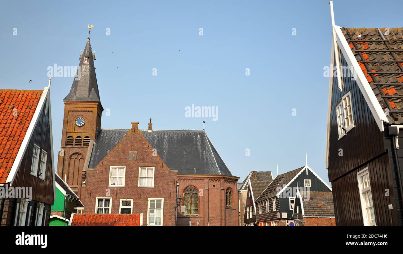 Marken, a fishing village with traditional wooden houses and the church ...