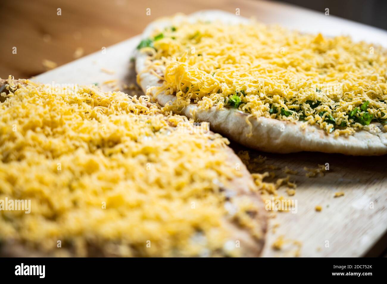indian bread with herbs, cream and grated cheese as starter Stock Photo ...