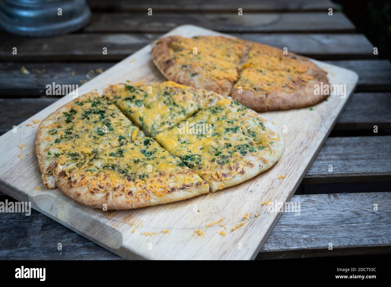 indian bread with herbs, cream and grated cheese as starter Stock Photo ...