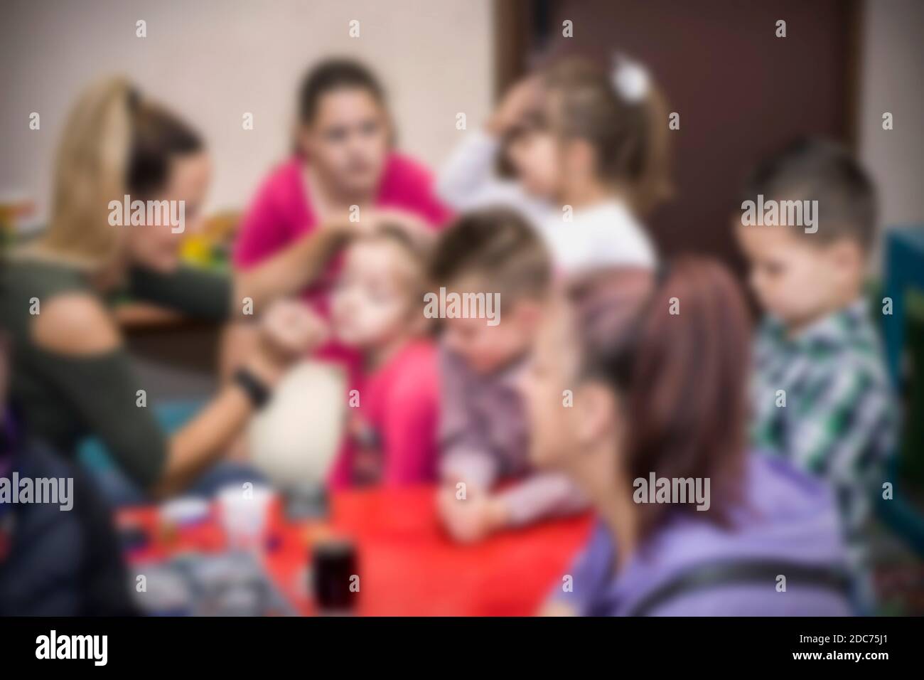 Blurred kids at birthday party doing makeup. Waiting in line, image for ...