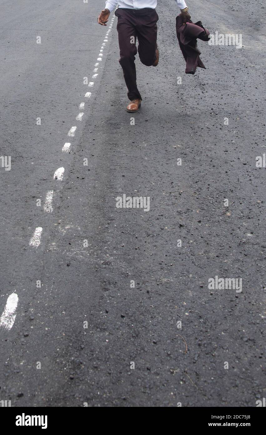 Running in a suit hi-res stock photography and images - Alamy