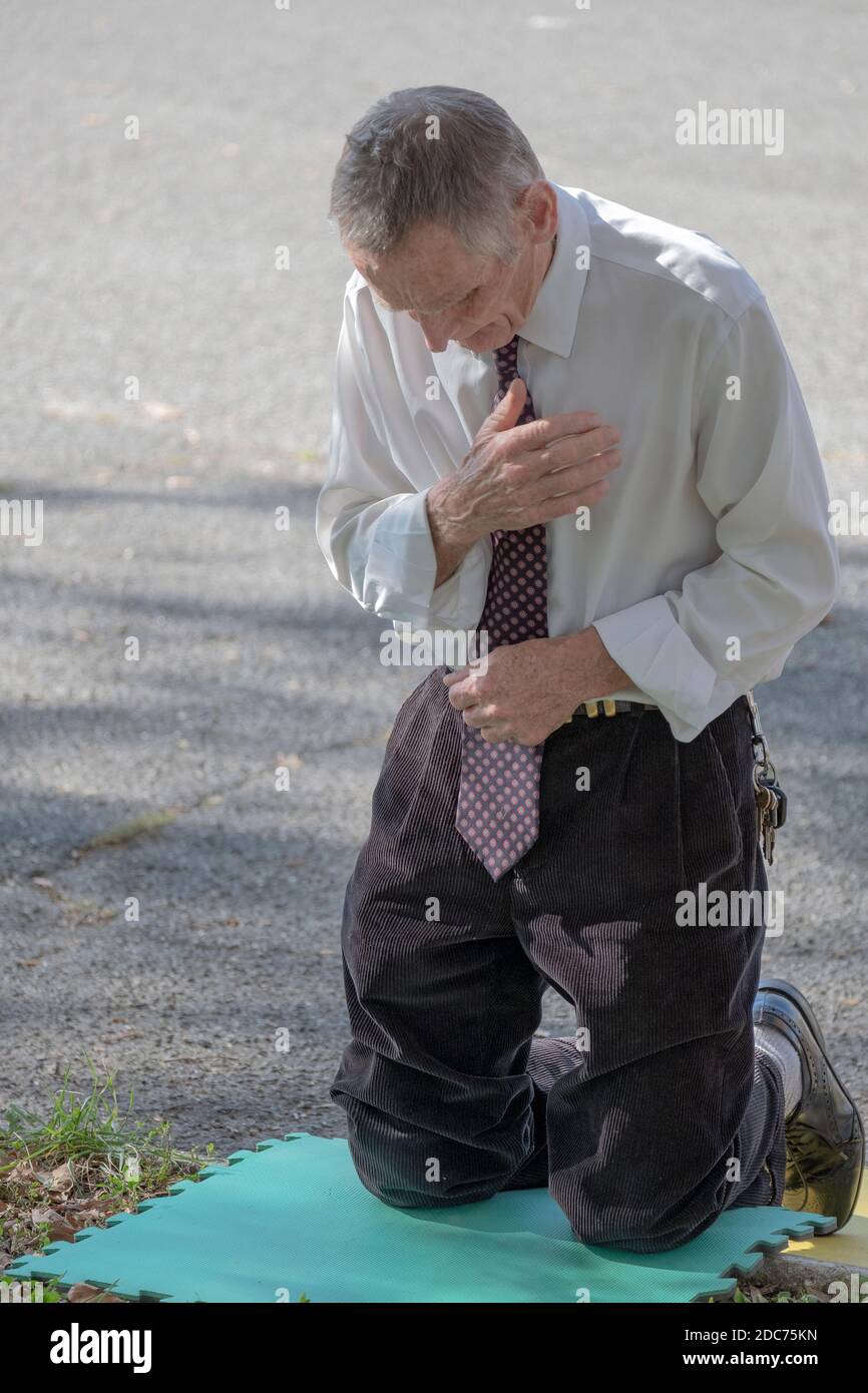 A devout Christian man prays at the Vatican Pavilion site in Flushing ...