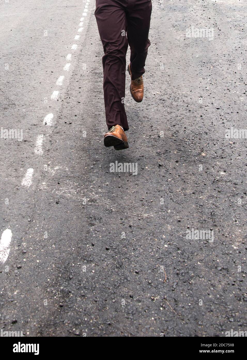 Running in a suit hi-res stock photography and images - Alamy