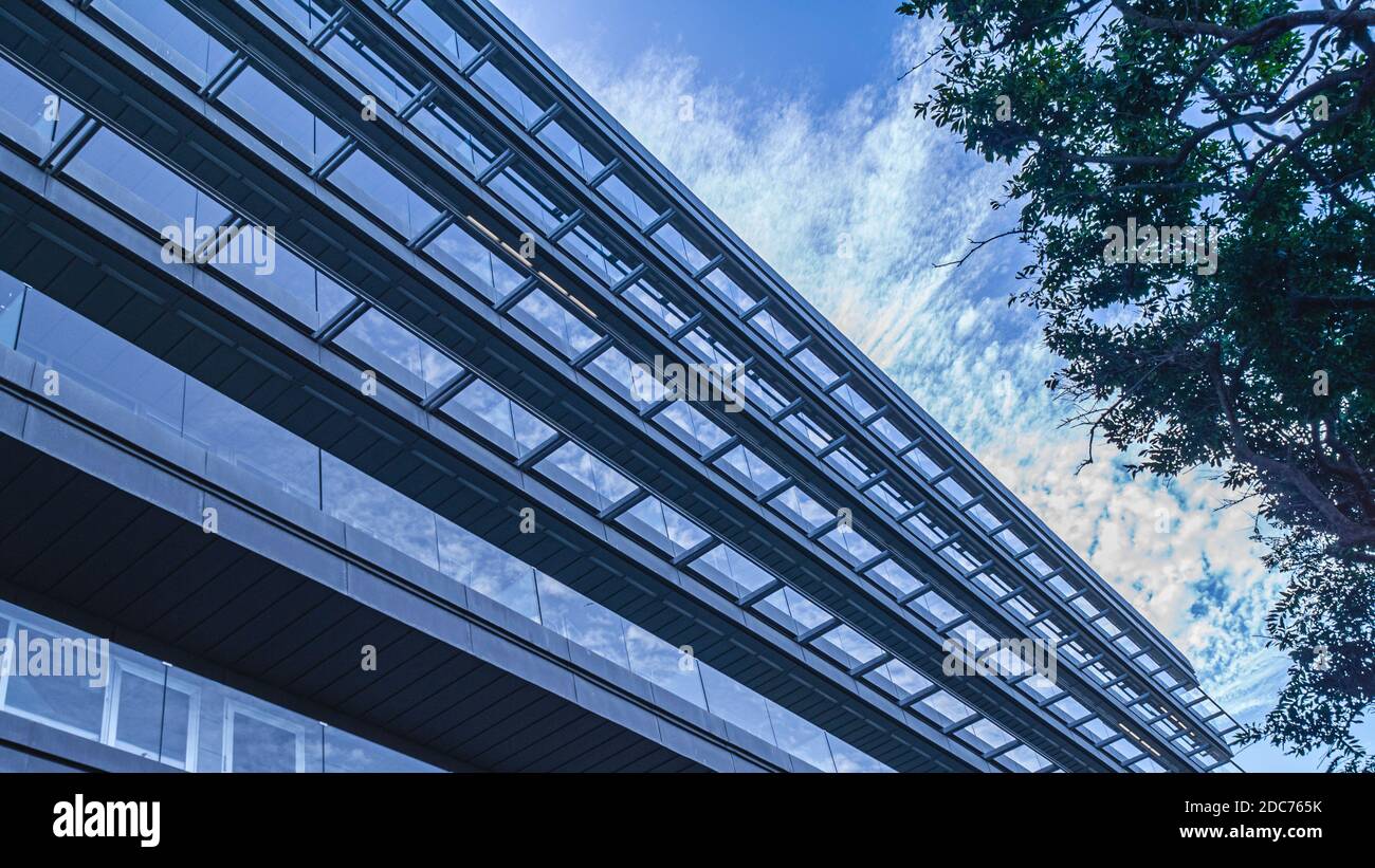 Blue glass windows reflect hi-res stock photography and images - Alamy