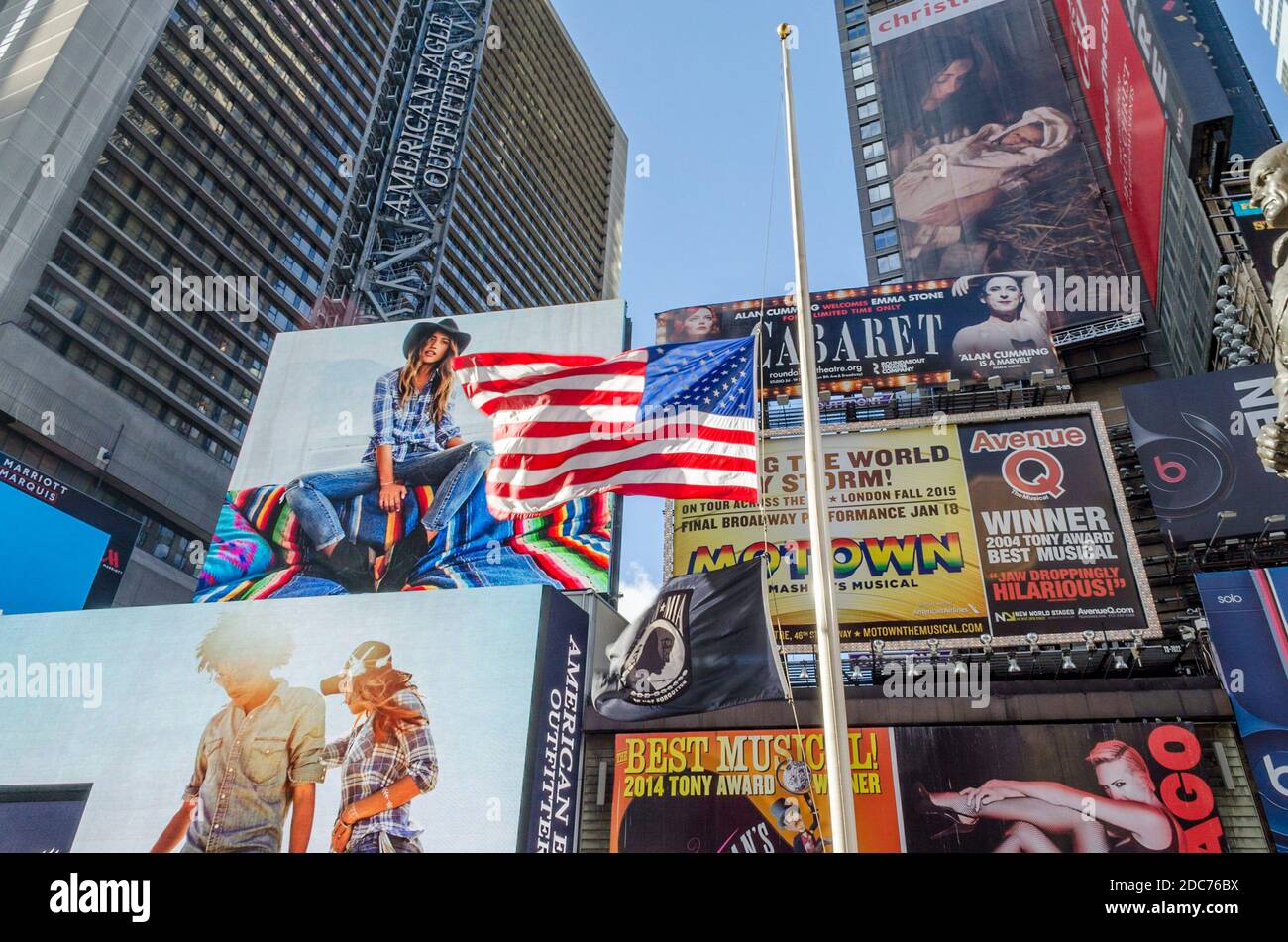 Flag Waving Proudly in Manhattan Times Square. Advertisement Signs and ...