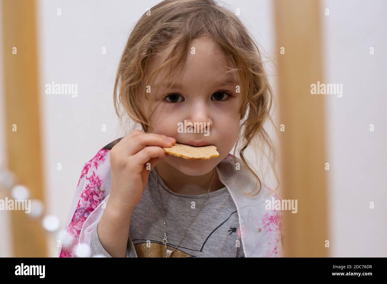 Little girl eating cookie hi-res stock photography and images - Alamy
