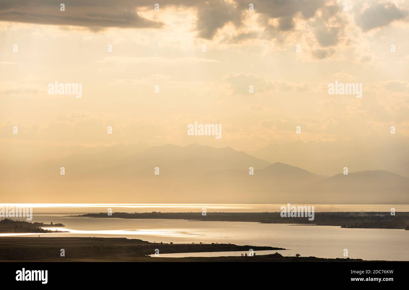 Sun on Issyk Kul Lake at sunset near Karakol in Kyrgyzstan Stock Photo ...
