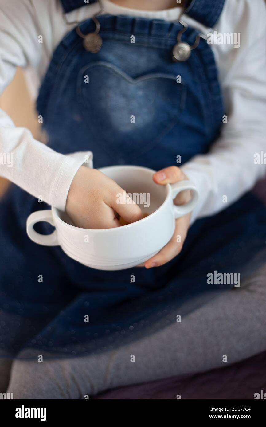 Close up of child hands eating healthy snacks from a bowl Stock Photo ...