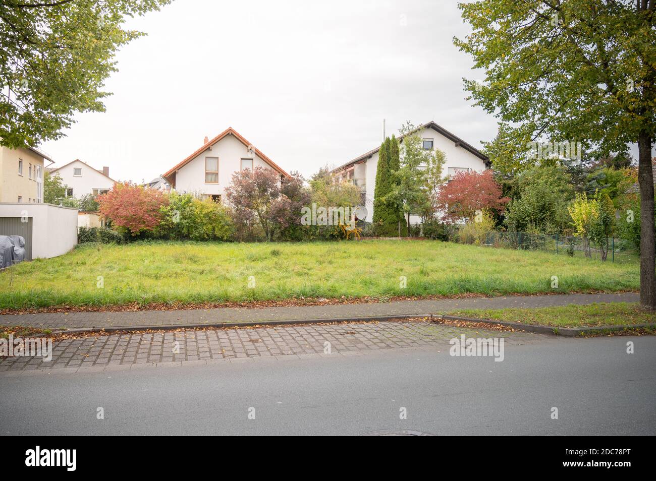 a building gap in a city despite a building boom Stock Photo - Alamy