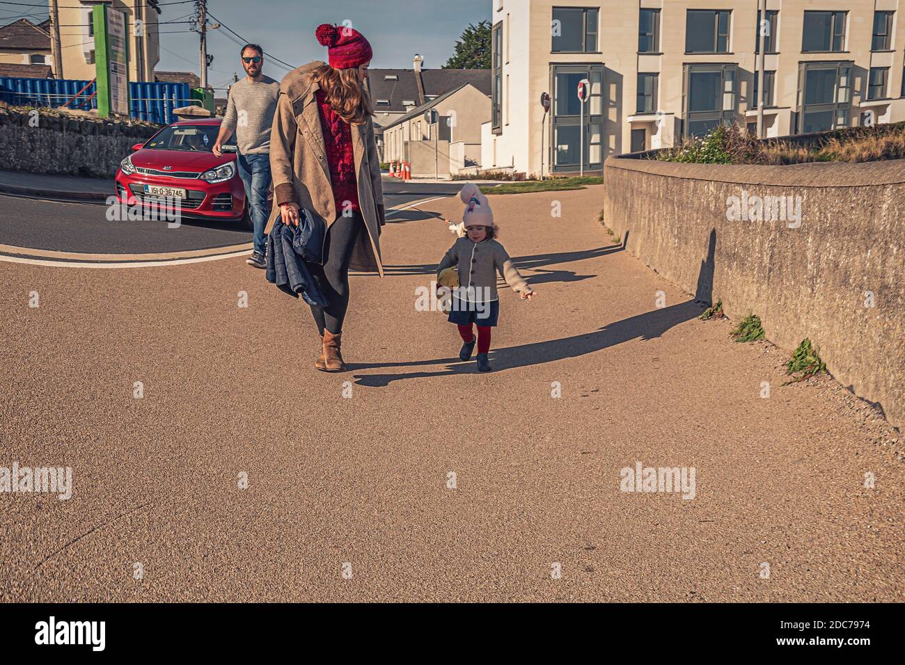 Childhood. Girl playing with mummy shadow in sunny day Stock Photo - Alamy