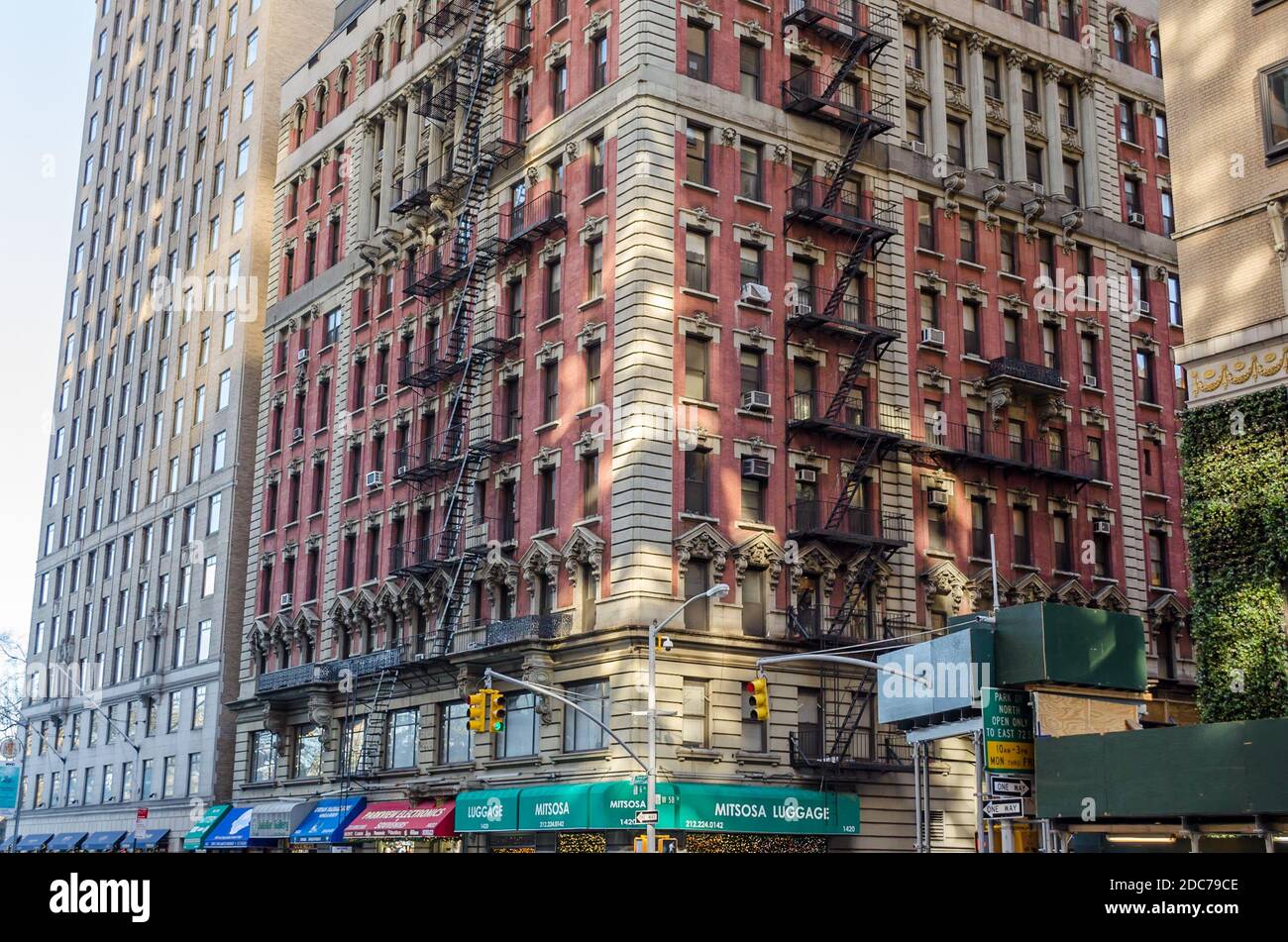 Typical Manhattan Building With Fire Escape Ladders and Many Stores on ...