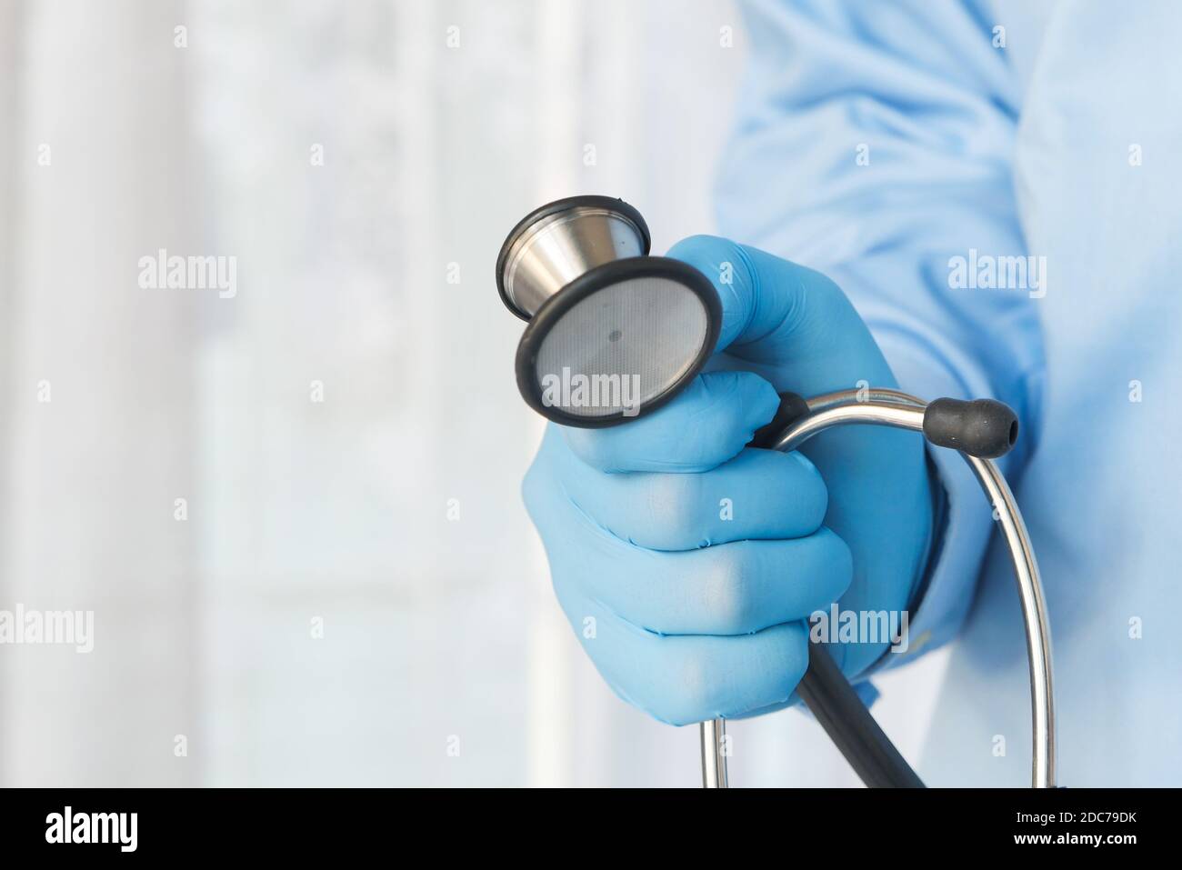 Doctor using stethoscope check young hi-res stock photography and ...