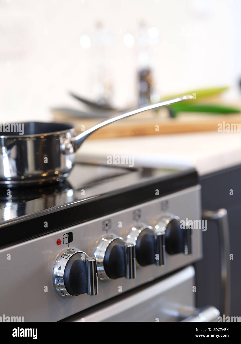 Electric oven and hob cooker in designer kitchen Stock Photo - Alamy
