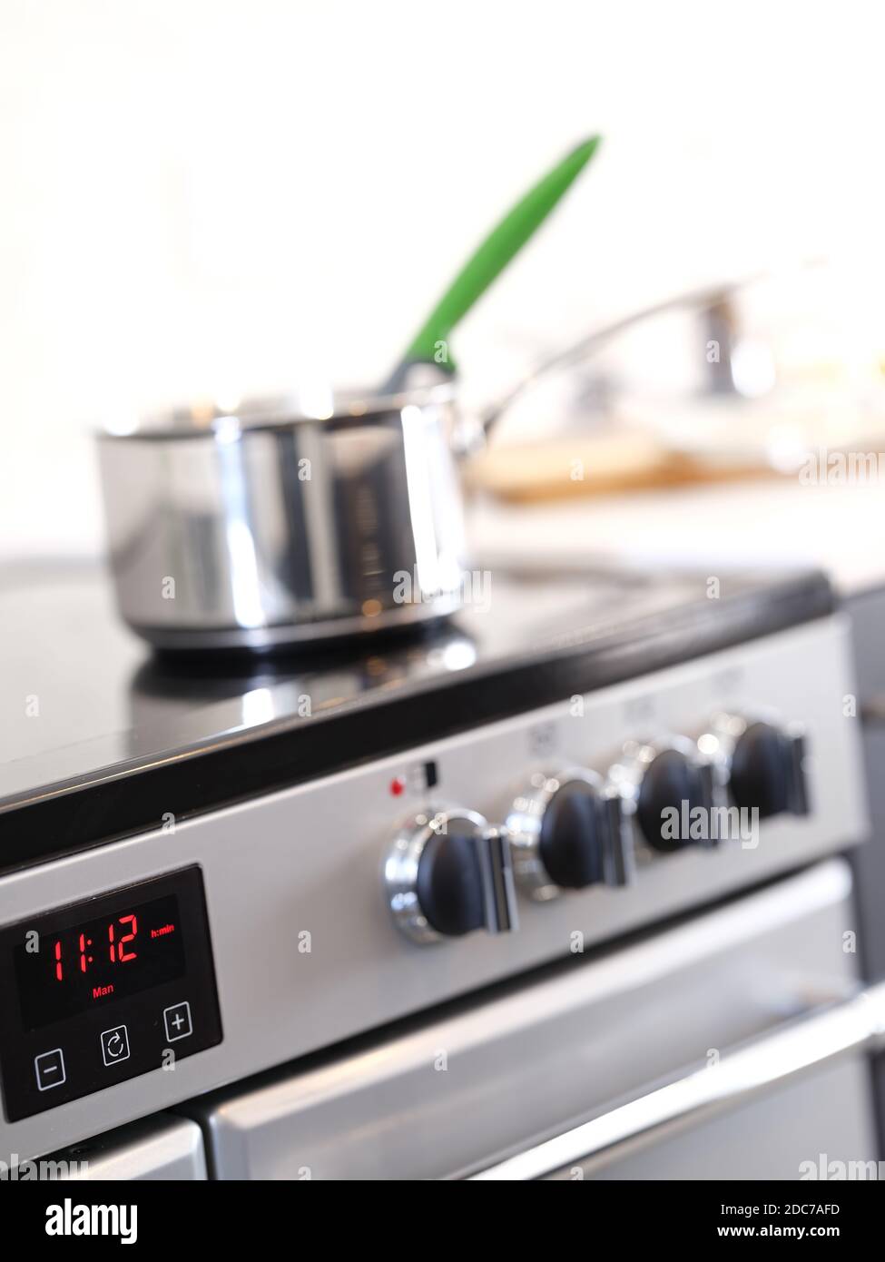 Electric oven and hob cooker in designer kitchen Stock Photo - Alamy