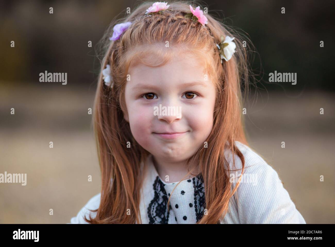 Portrait of an adorable, ginger little girl smiling Stock Photo - Alamy