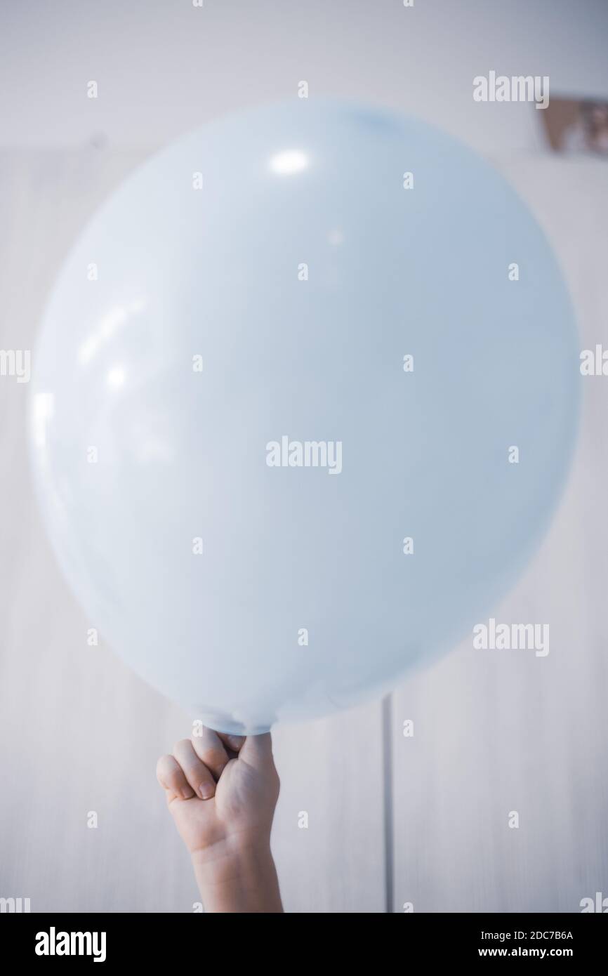 Child blowing up balloon hi-res stock photography and images - Alamy