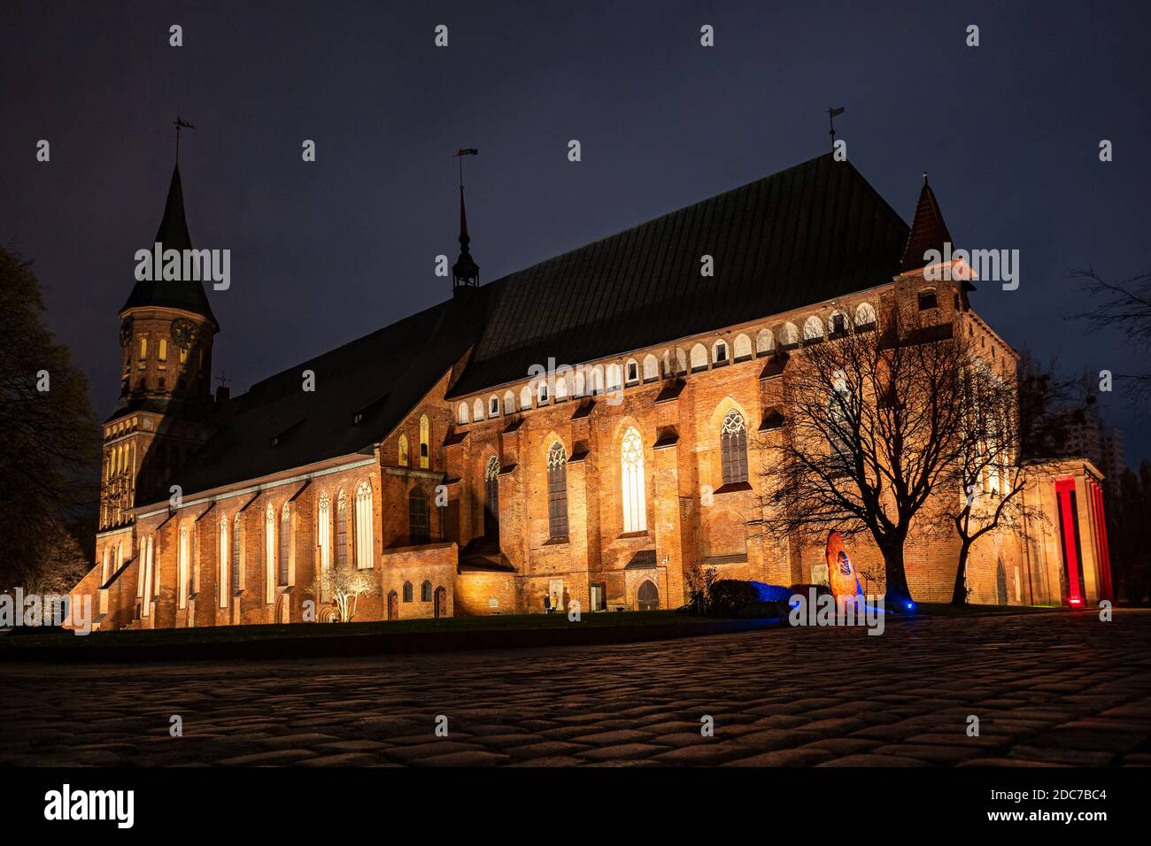 Brick Gothic style Cathedral at night, side view. Formerly old German ...
