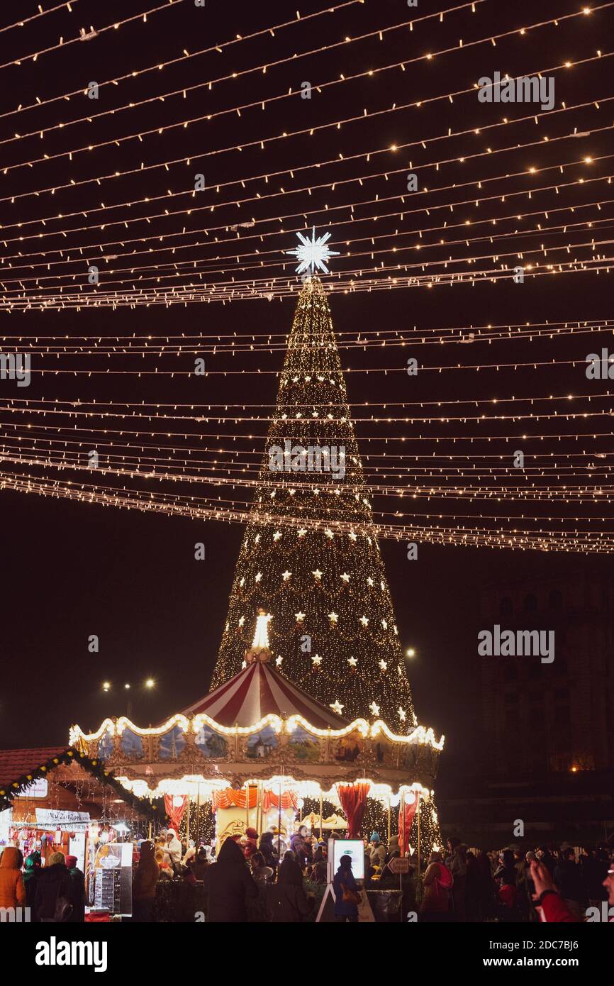 Huge Christmas tree full of lights at a Christmas fair Stock Photo - Alamy