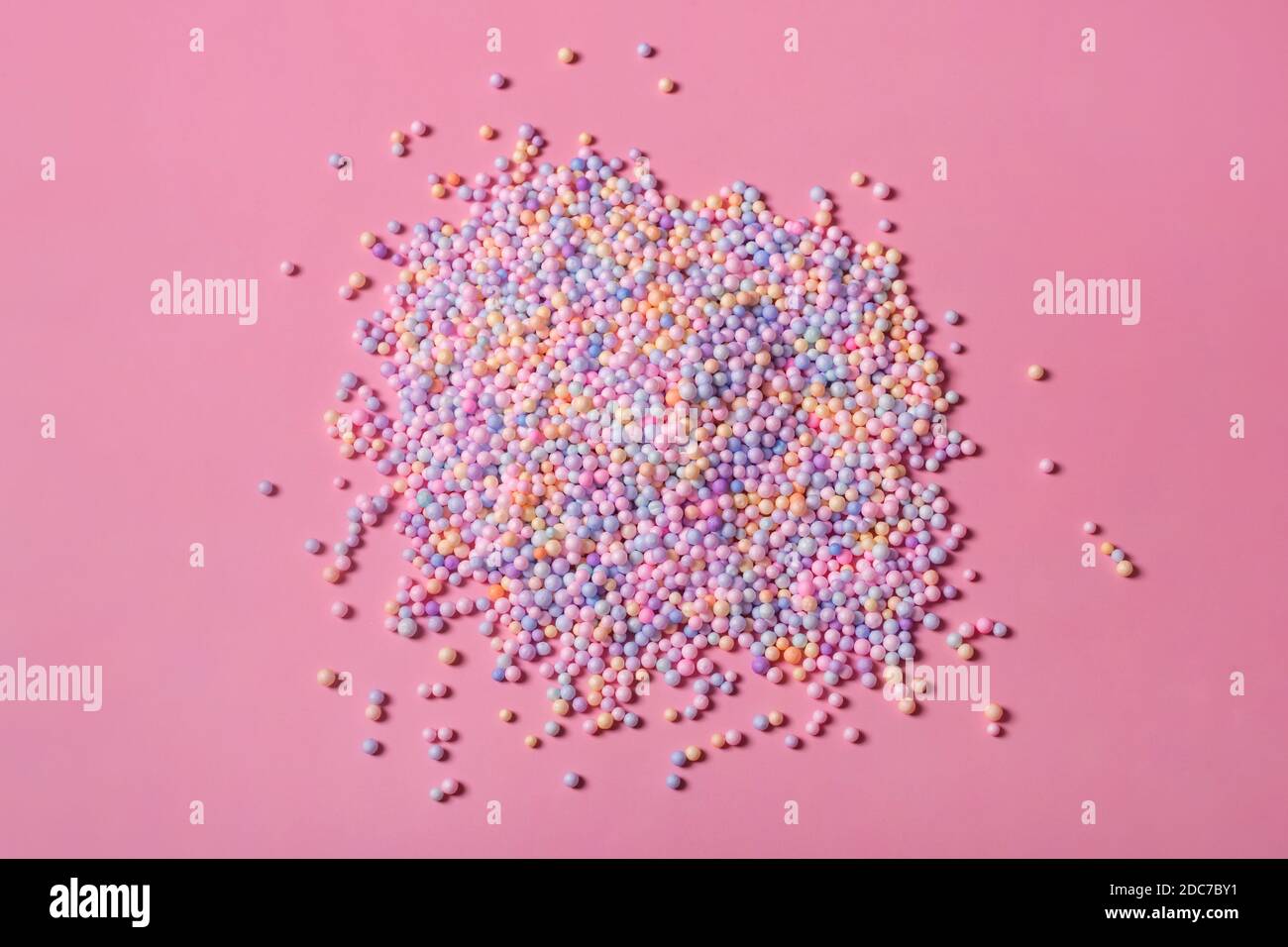 Pile of pastel color balls on pink. Styrofoam or Polystyrene foam ...