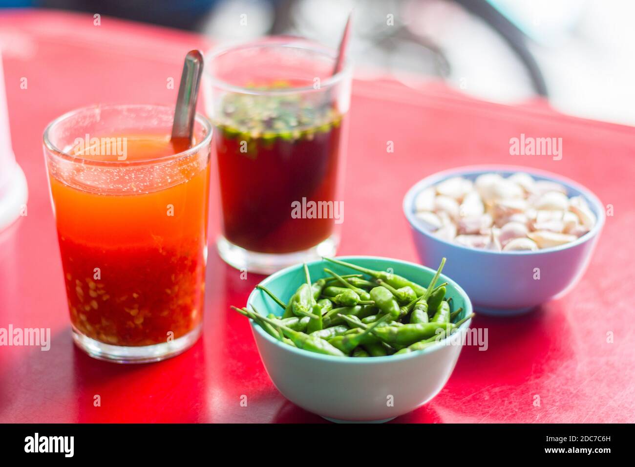 Pepper, garlic and thai condiments at a street food diner in Bangkok ...