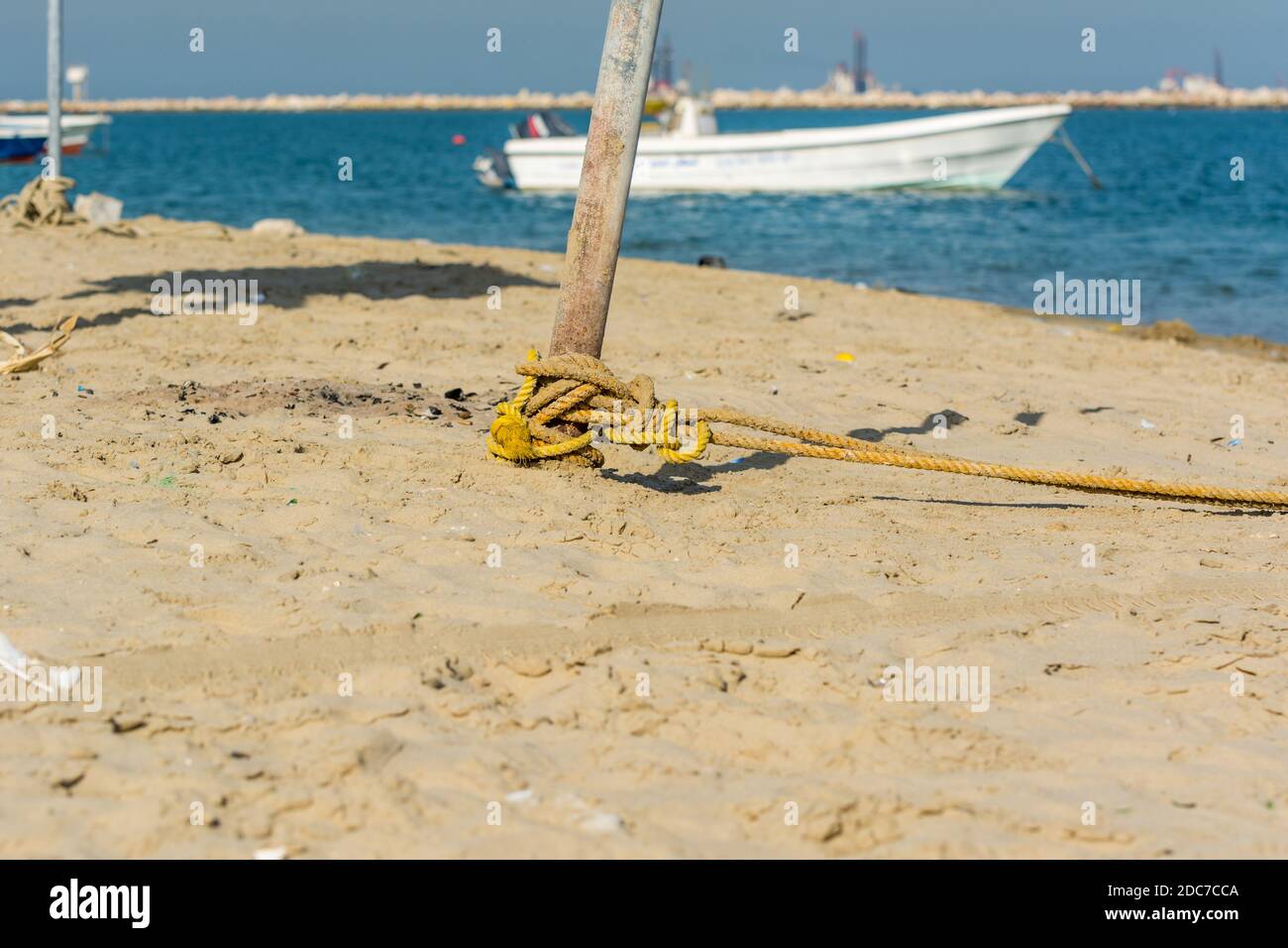 Ropes on a timber pole at the beach at the corniche park in Dammam ...