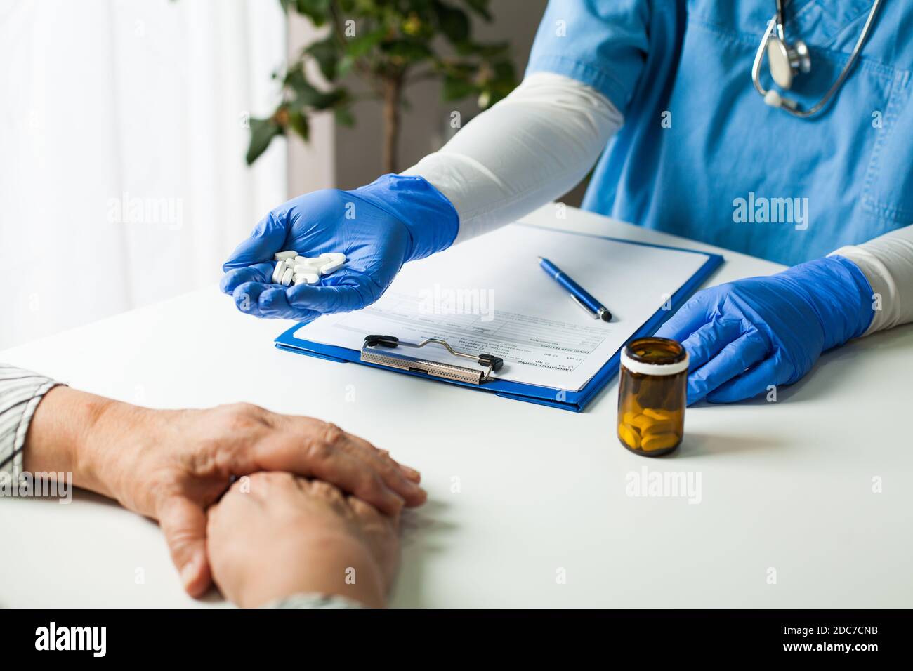 Female doctor handing over prescription hi-res stock photography and ...