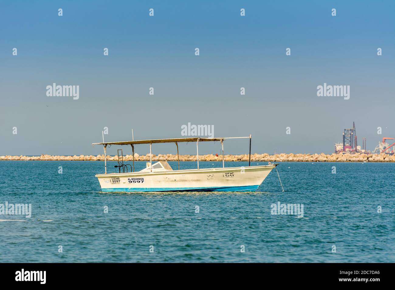 Fishing boat floating at the sea at the corniche park, Dammam, Saudi ...
