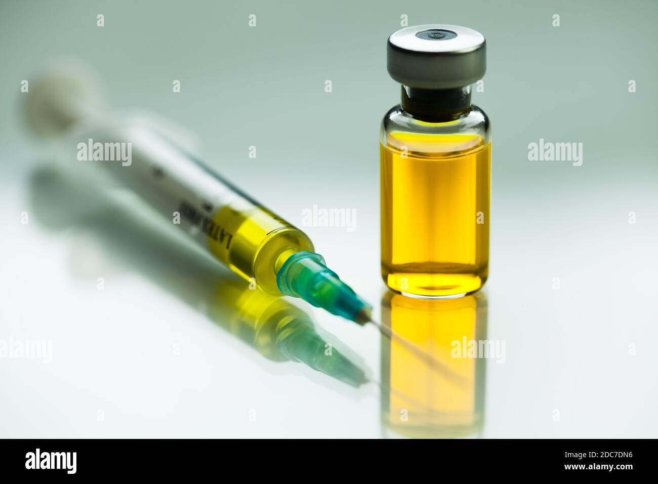 Syringe with needle & vial ampoule with yellow liquid,illustration of ...