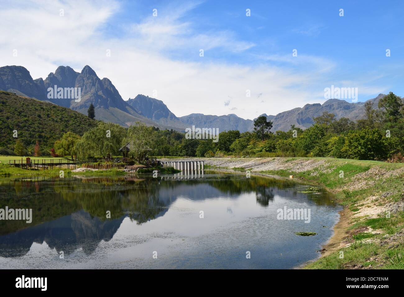 Mountain reflecting on water Stock Photo - Alamy