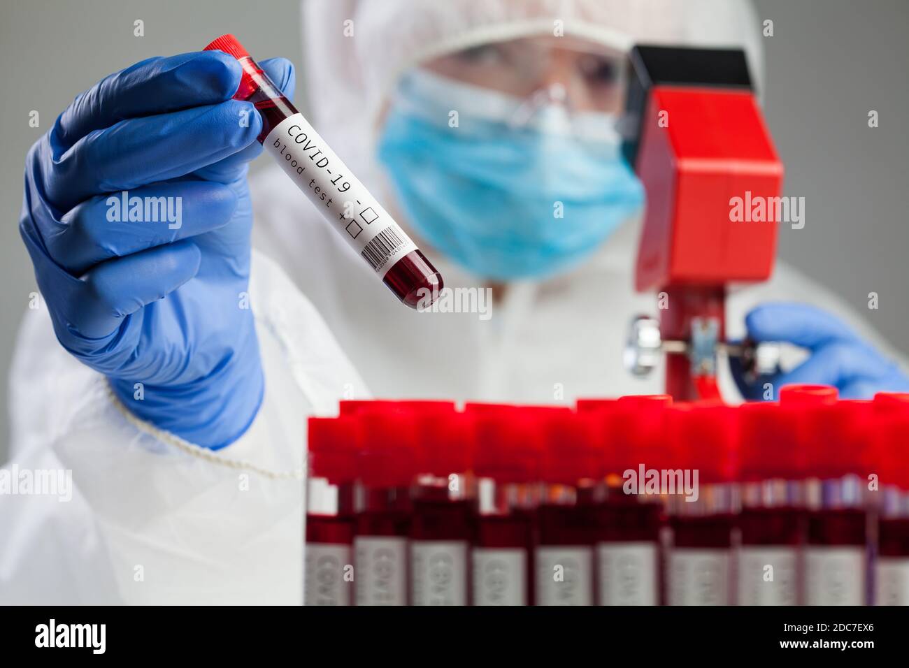 Medical technologist or lab scientist microscope examining Coronavirus ...