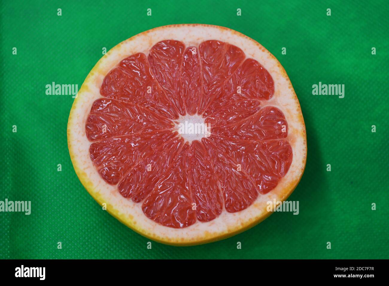 Ripe and tasty fruits, fresh grapefruit cut in half, sliced grapefruit ...