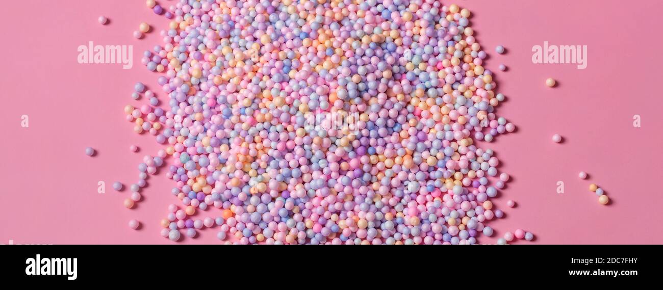Pile of pastel color balls on pink. Styrofoam or Polystyrene foam ...