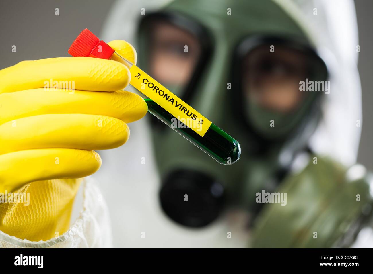Lab scientist or medical researcher holding CORONAVIRUS test tube ...