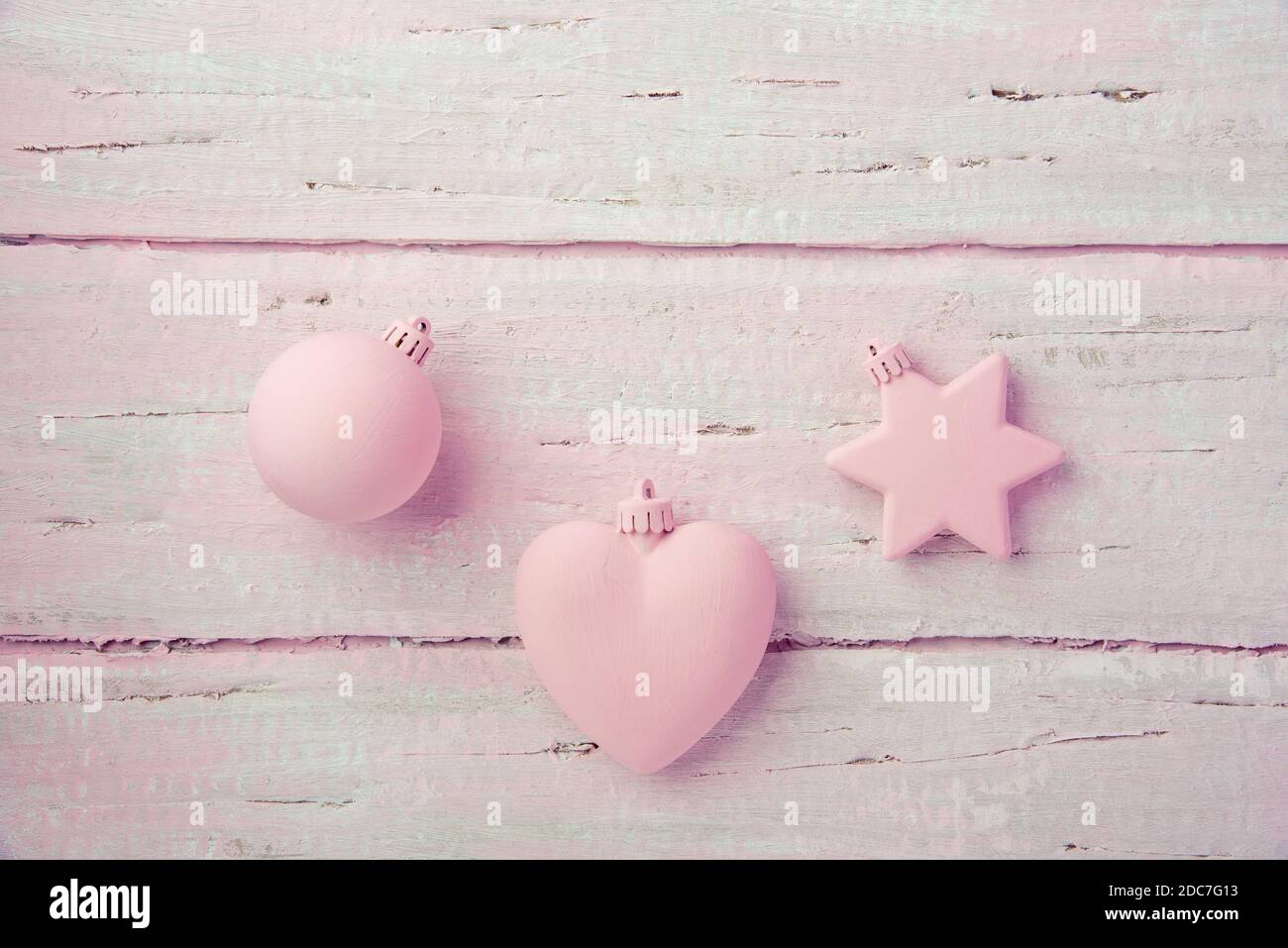 New Year's Christmas toys, heart, star and ball on a beautiful wooden ...