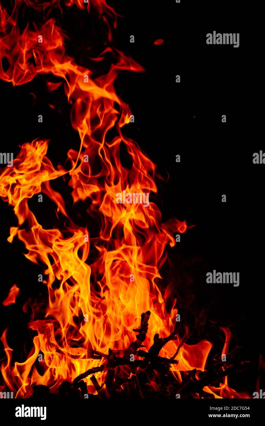 A vertical shot of a beautiful burning fire at night Stock Photo - Alamy