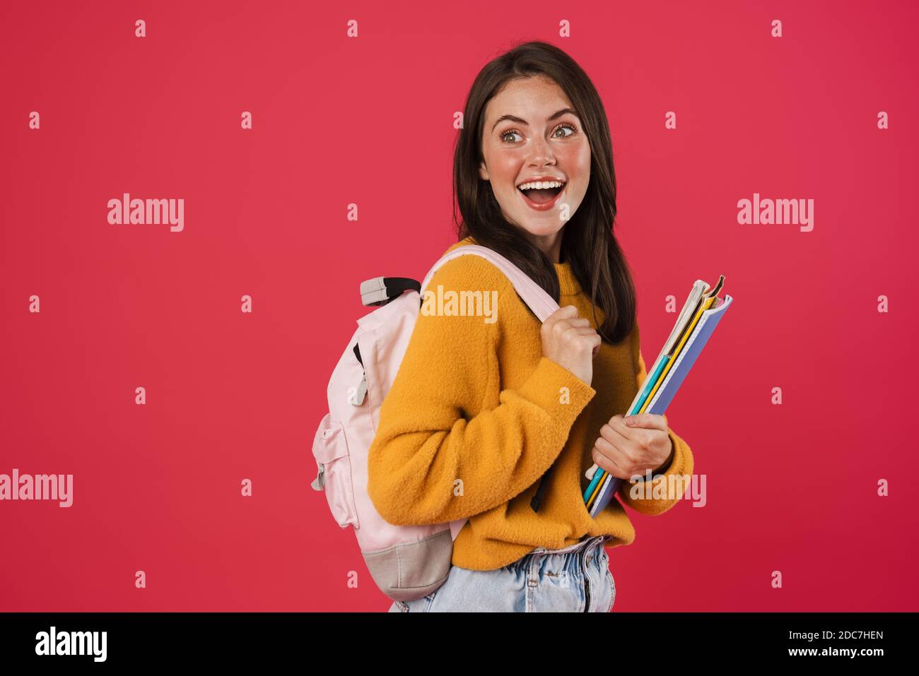 Image of happy beautiful student girl posing with exercise books ...