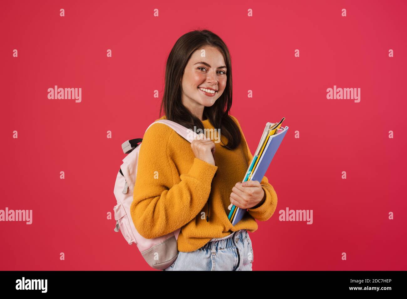 Image of happy beautiful student girl posing with exercise books ...