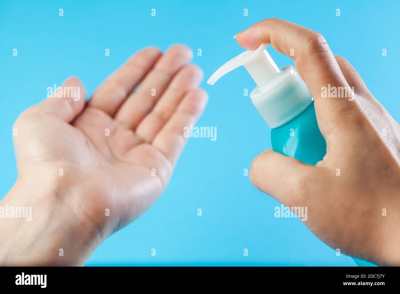 Female caucasian person applying dry wash antibacterial sanitizer gel ...