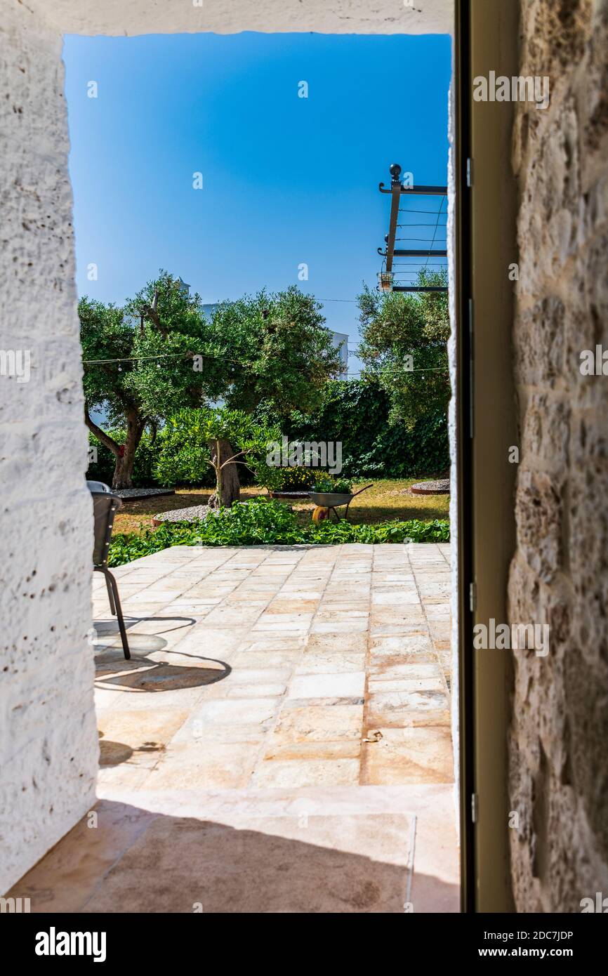 Olive trees and trulli of the Itria valley. Puglia Stock Photo - Alamy