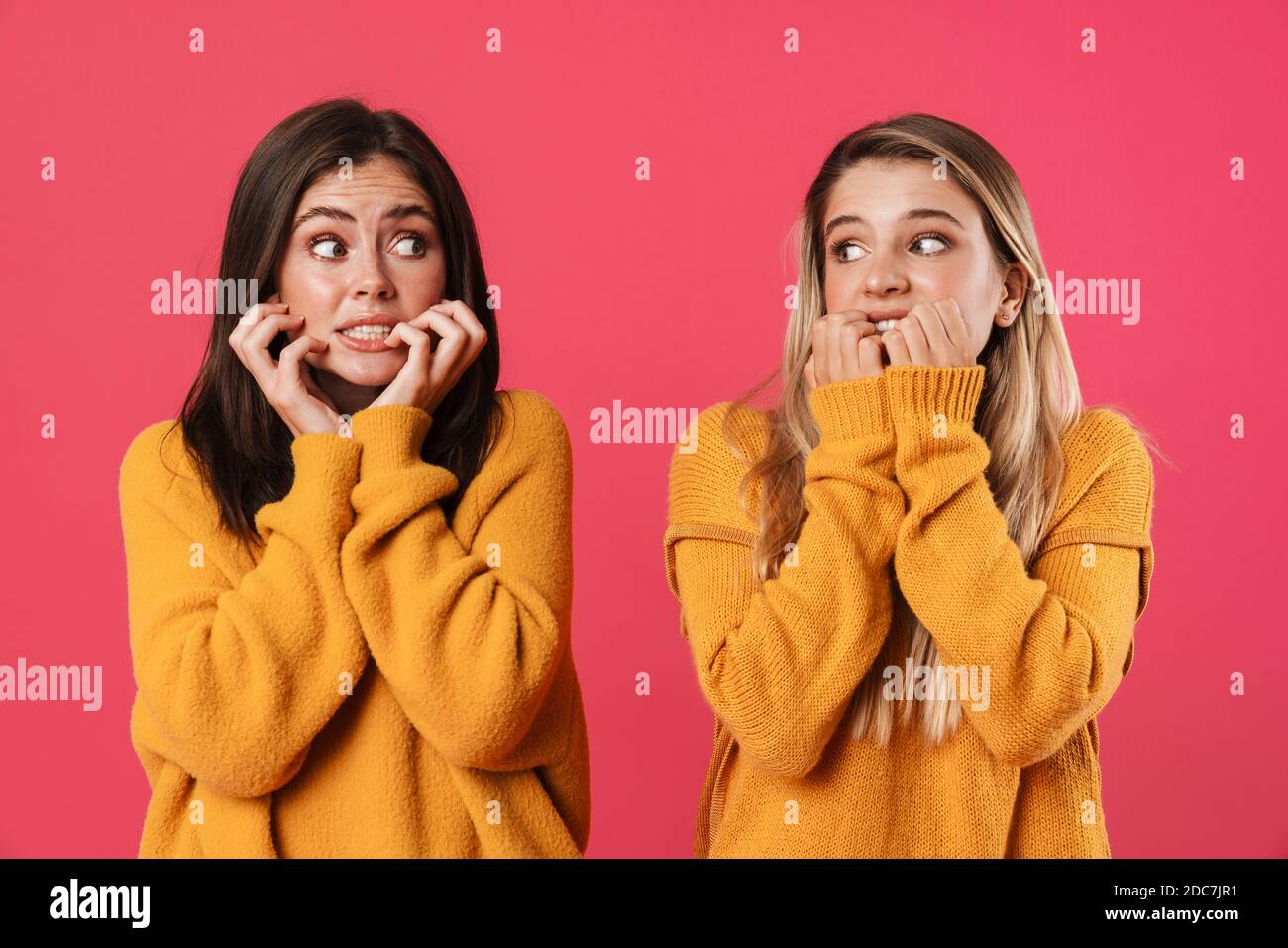 Image of scared caucasian women posing and looking at each other ...