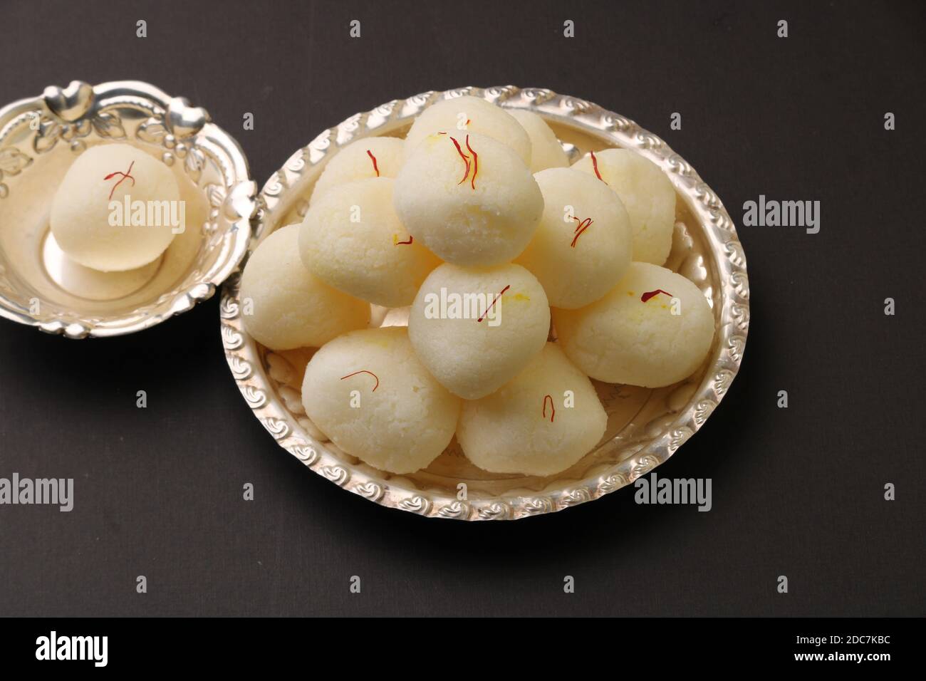 Famous Indian dessest rasgulla/ rosogulla/ roshogulla served in silver ...