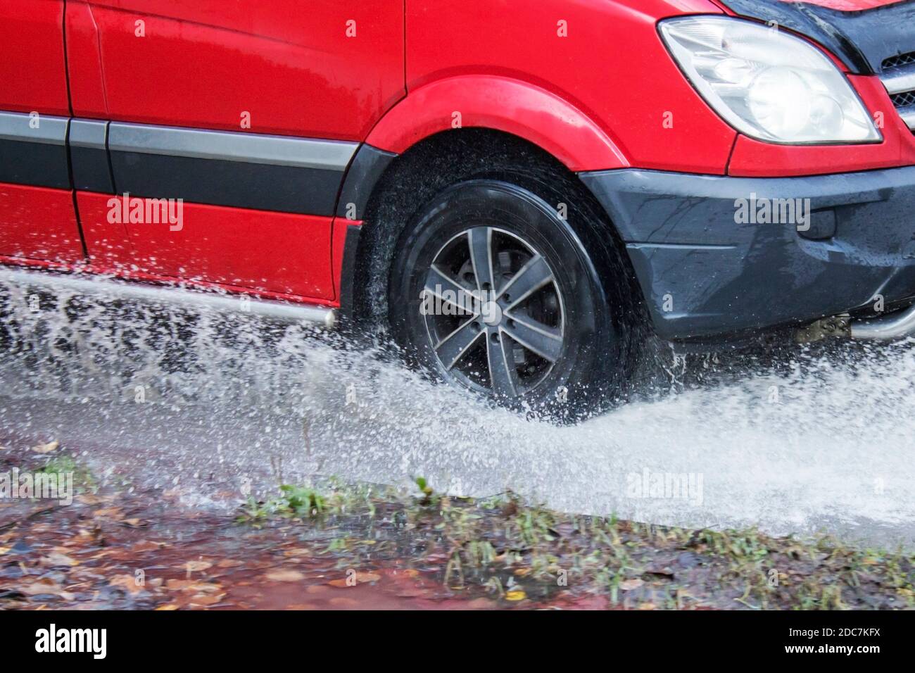 motion car rain big puddle of water spray from the wheels Stock Photo ...
