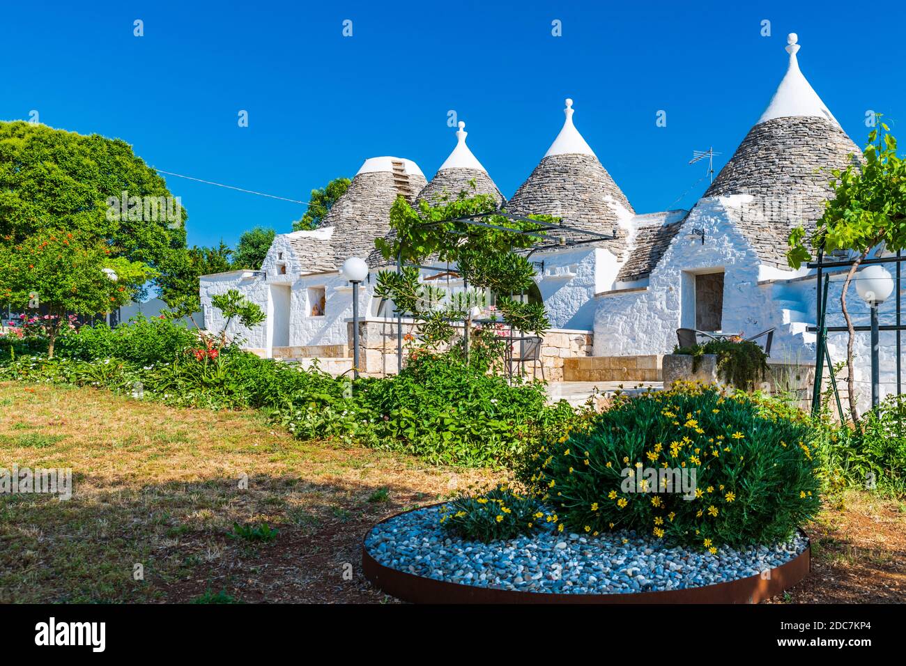Olive trees and trulli of the Itria valley. Puglia Stock Photo - Alamy