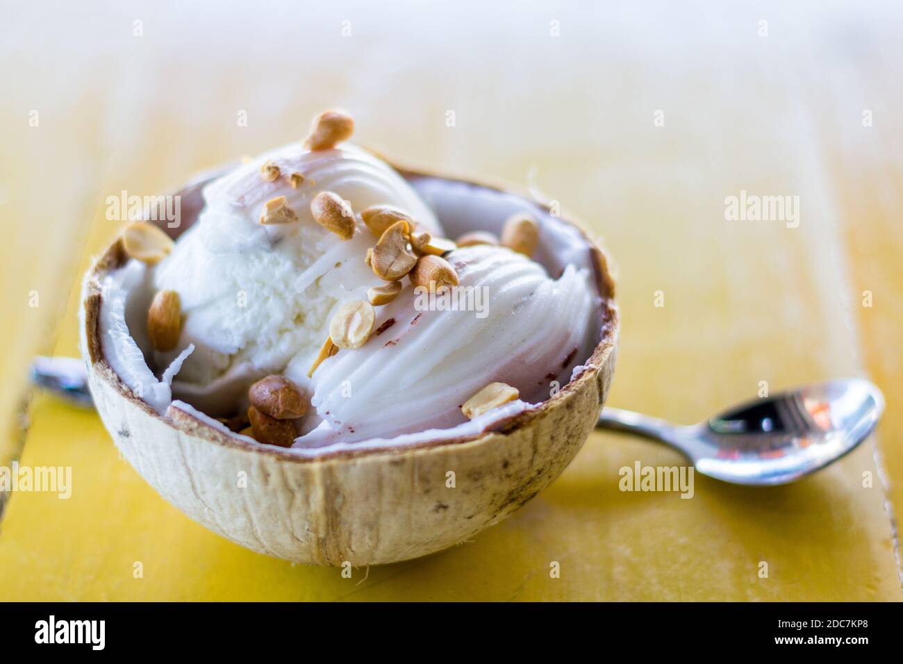 Traditonal Thai coconut ice cream in a coconut shell in Phuket ...