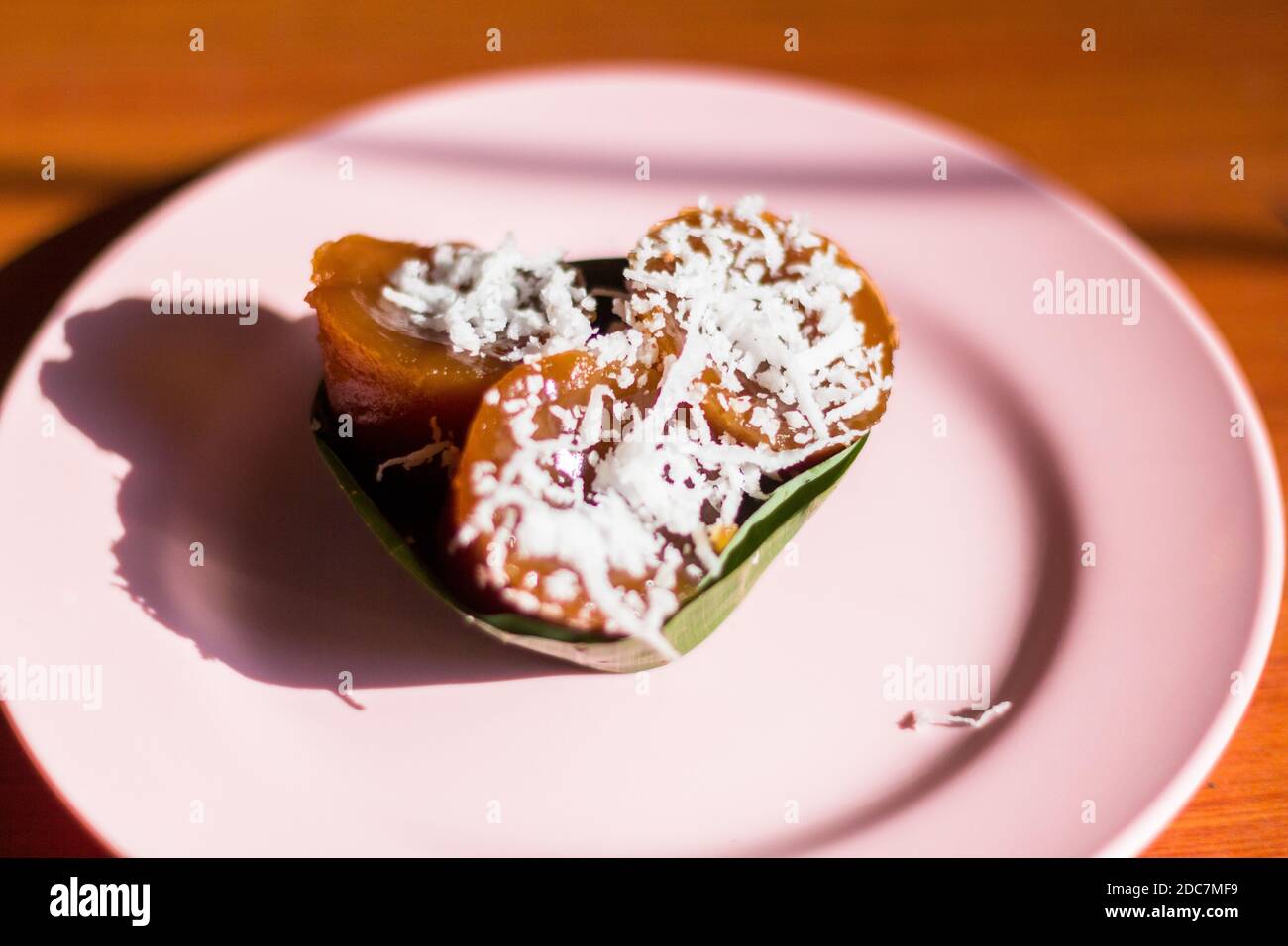 Traditional Thai rice cakes wrapped in banana leaves at a restaurant in ...