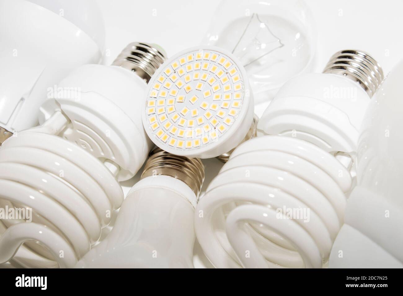 Several different led bulbs and compact fluorescent lamps with the size ...