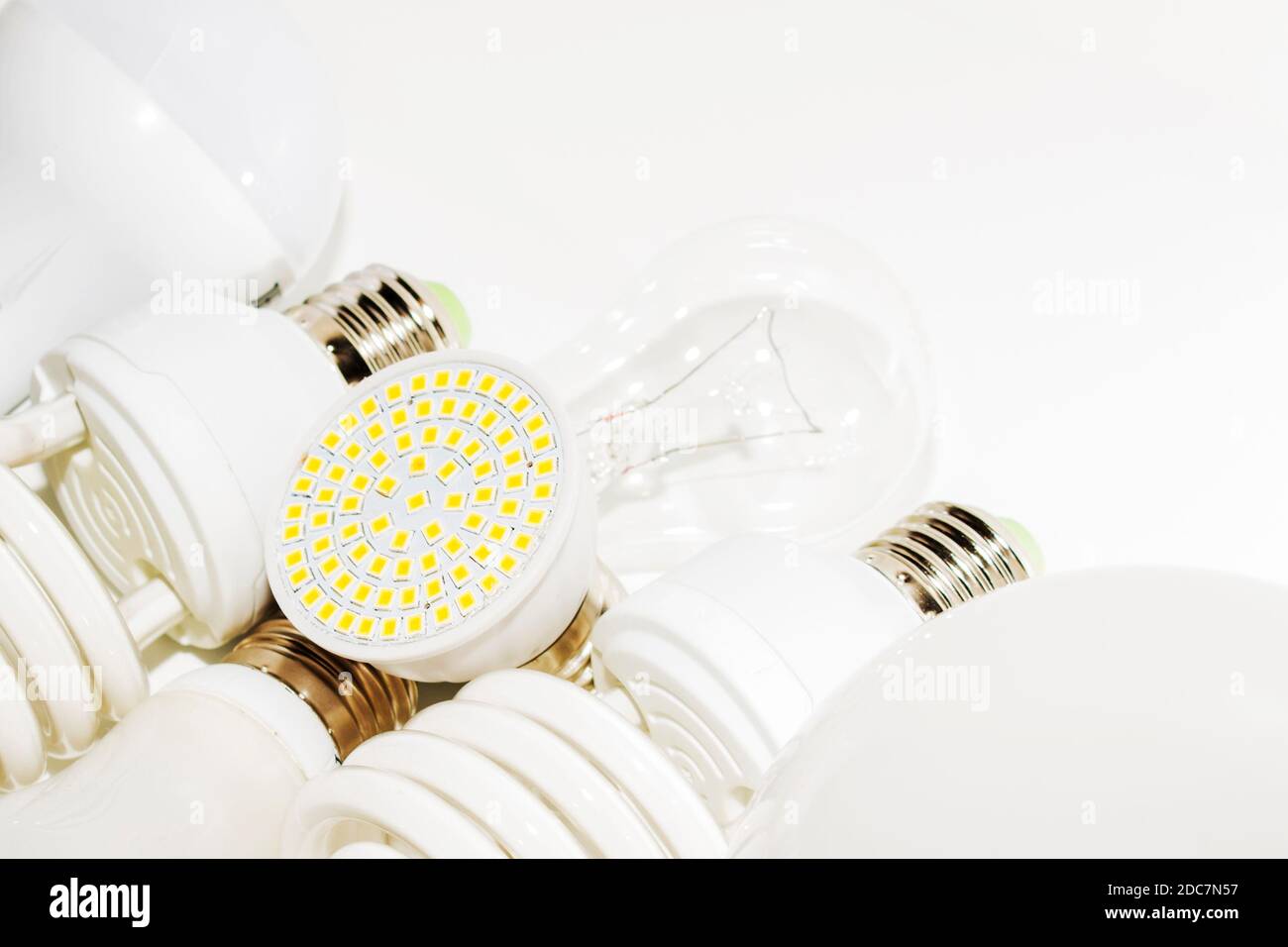 Several different led bulbs and compact fluorescent lamps with the size ...