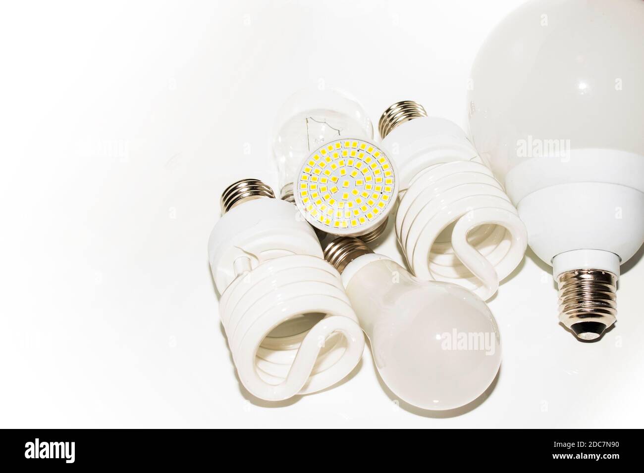 Several different led bulbs and compact fluorescent lamps with the size ...