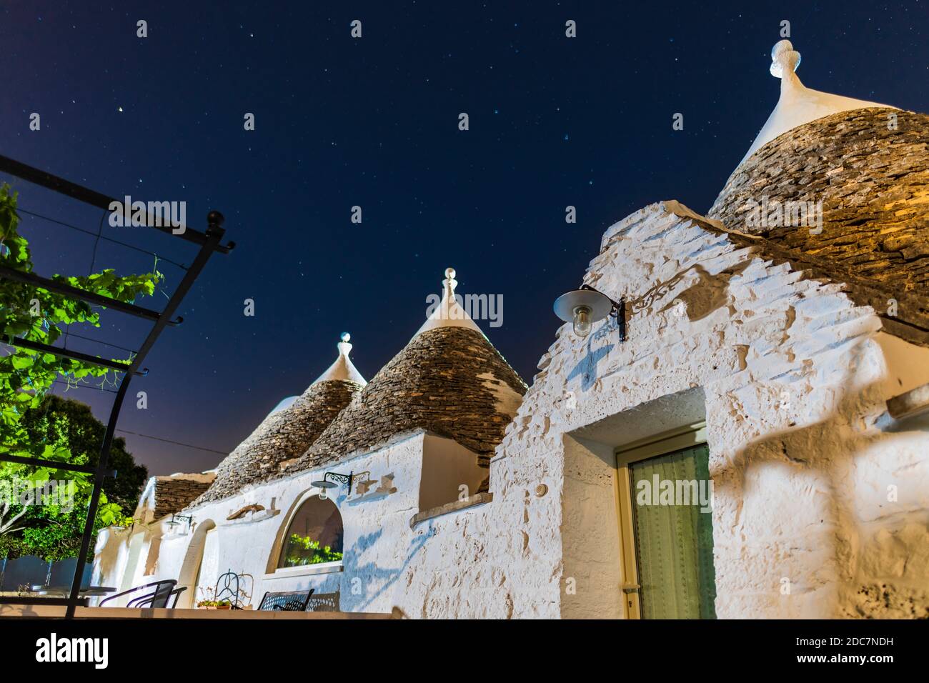 Olive trees and trulli of the Itria valley. Puglia Stock Photo - Alamy