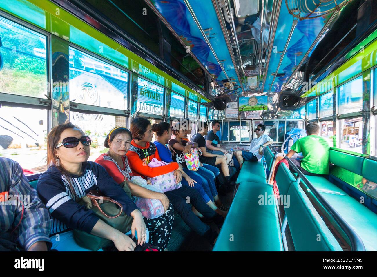 Passengers inside a songthaew Stock Photo - Alamy